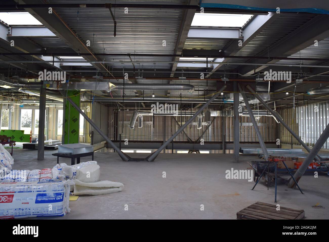 Metal-framed building under construction. Structure has mostly been ...