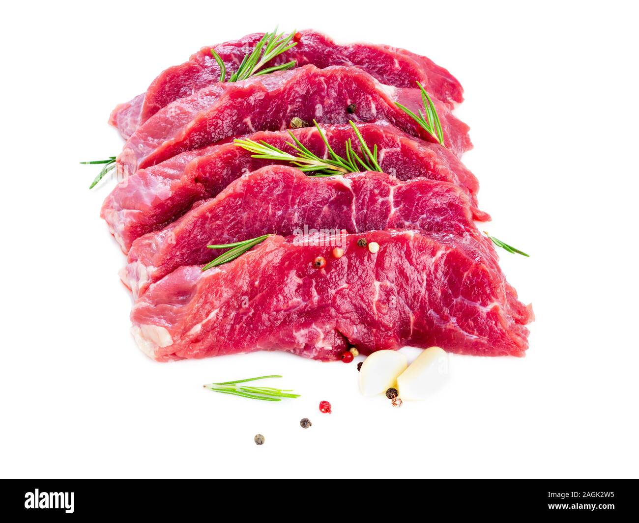 Raw meat, beef steak with seasoning on white background, side view ...