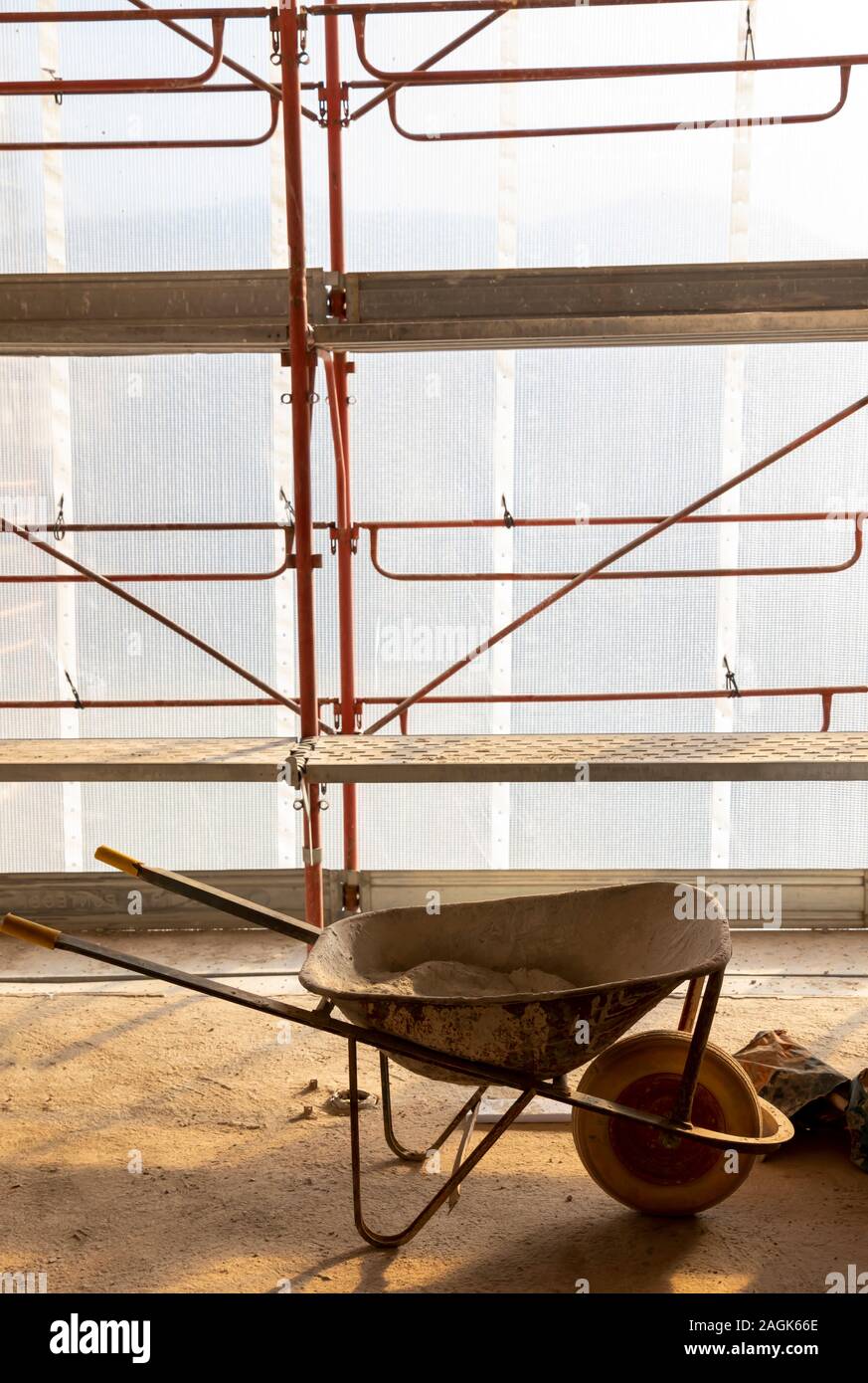 Wheelbarrow and Scaffolding in a Modern Apartment Under Construction in ...