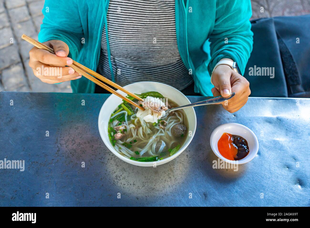 Woman hands using chopsticks hi-res stock photography and images - Alamy