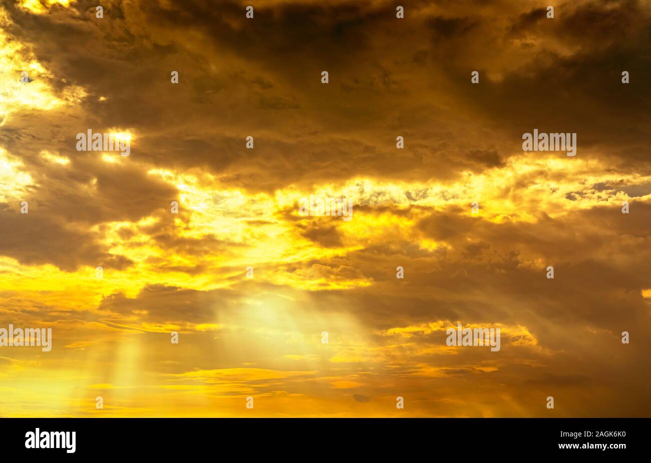 God light. Dramatic golden cloudy sky with sun beam. Yellow sun rays ...