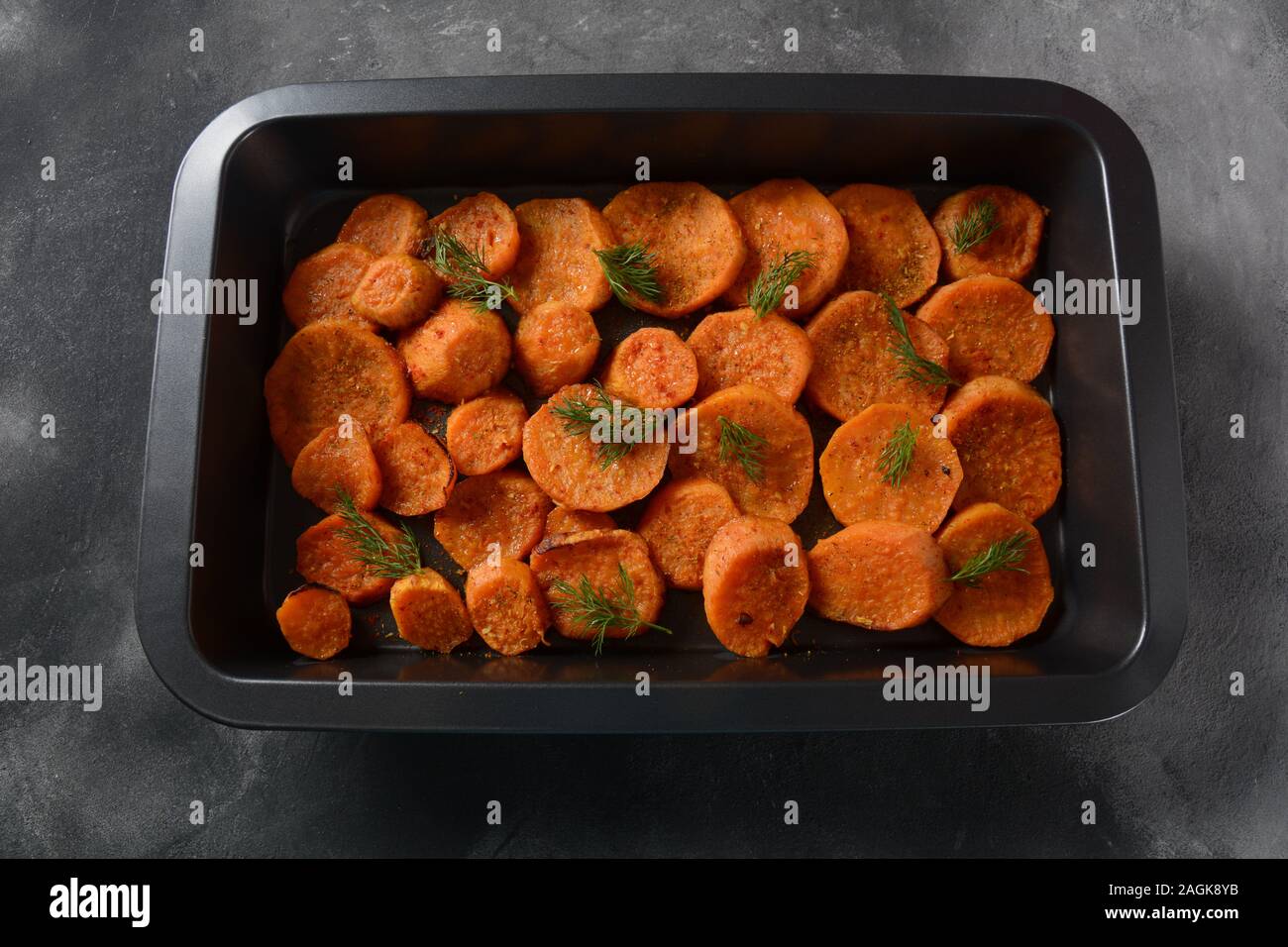 Healthy homemade baked orange sweet potato slices with herbs Vegan food ...