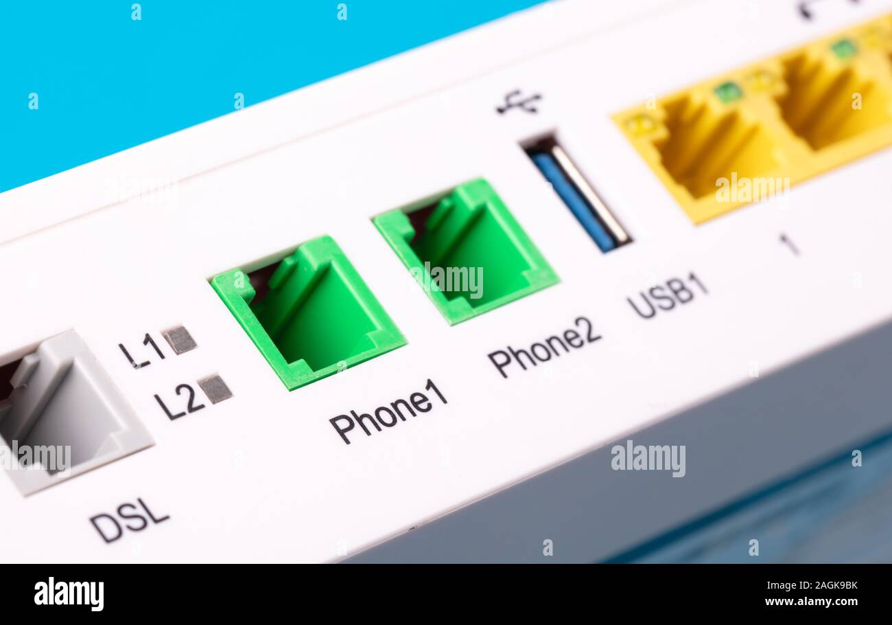 Desktop Home ADSL modem on a blue background back view, selective focus ...