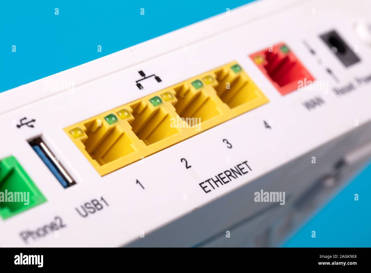 Desktop Home ADSL modem on a blue background back view, selective focus ...