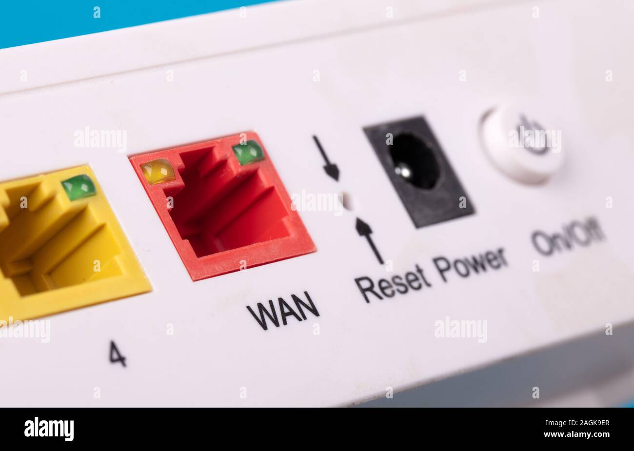 Desktop Home ADSL modem on a blue background back view, selective focus ...