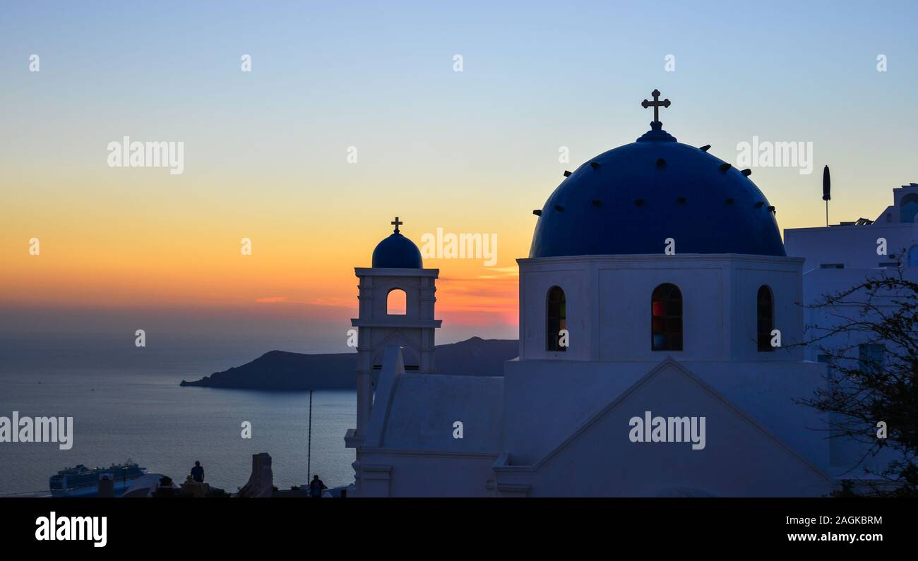 Orthodox church at sunset on Santorini Island, Greece. Santorini is one ...