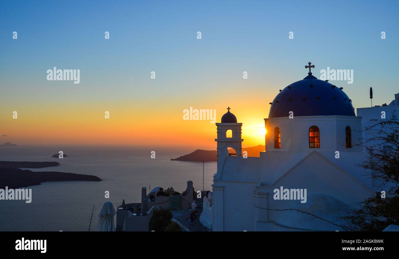 Orthodox church at sunset on Santorini Island, Greece. Santorini is one ...