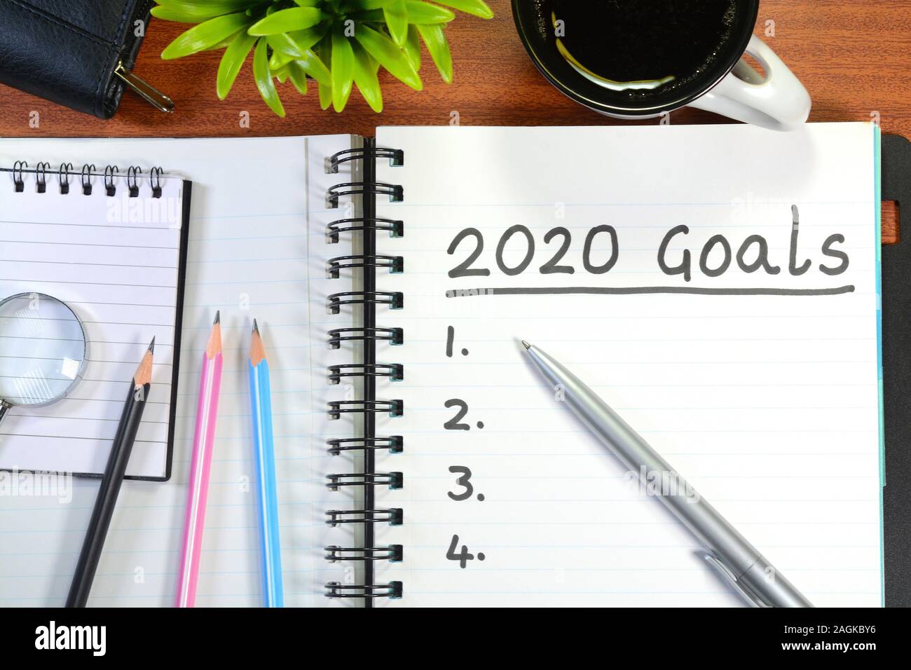 2020 goals written on a book in the office desk Stock Photo - Alamy