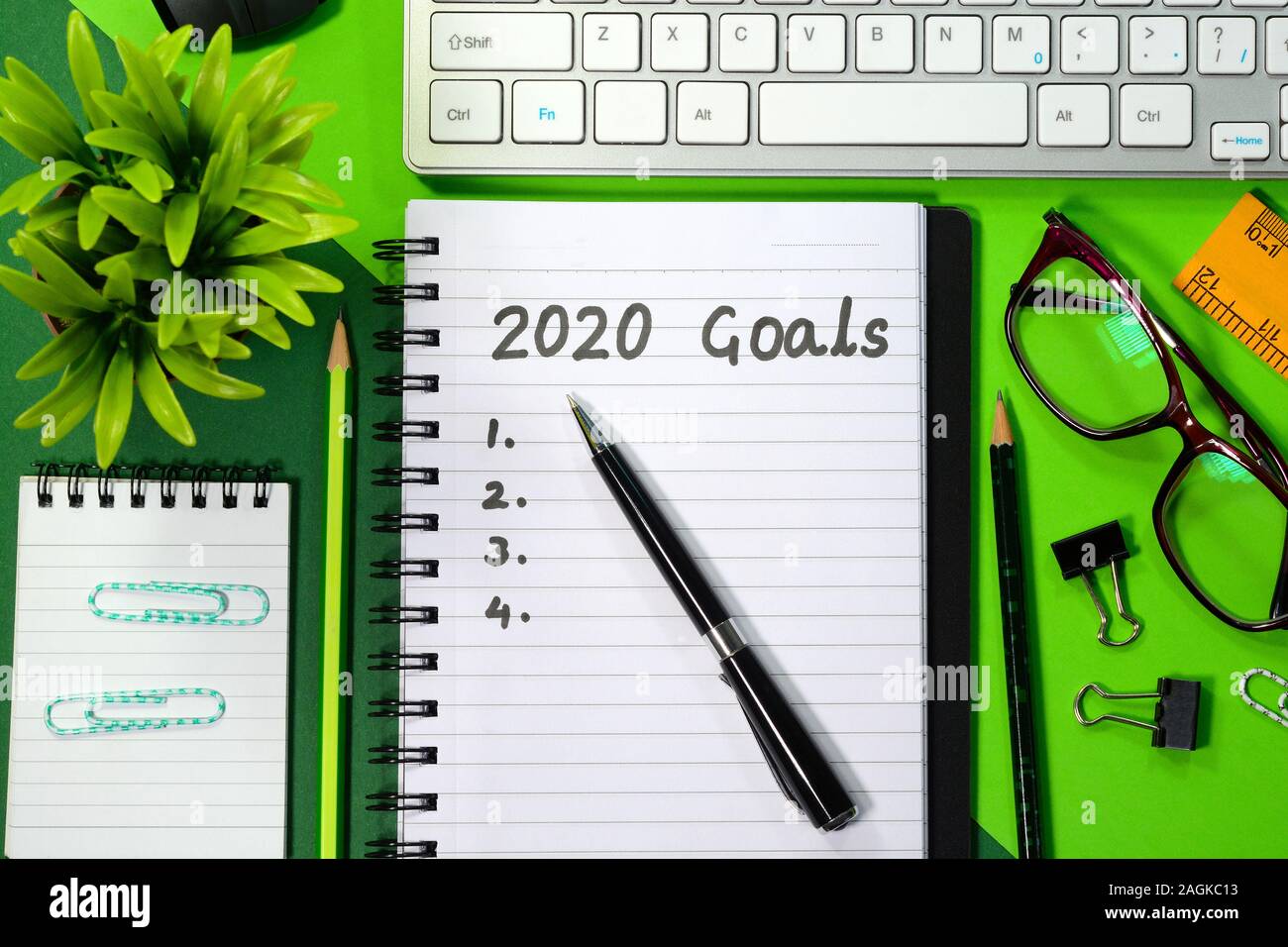 2020 goals written on a book in an office desk Stock Photo - Alamy