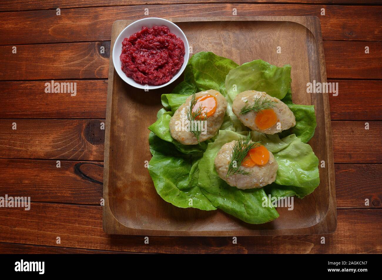 Traditional Jewish Passover food- gefilte fish with carrots, lettuce ...