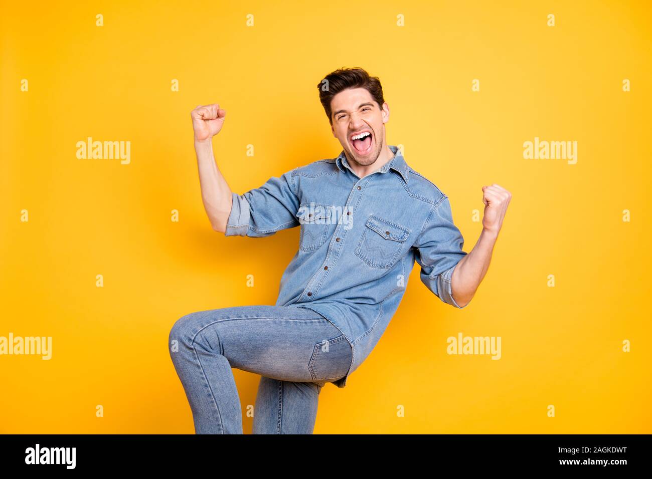 Turned photo of crazy ecstatic excited overjoyed man screaming shouting ...
