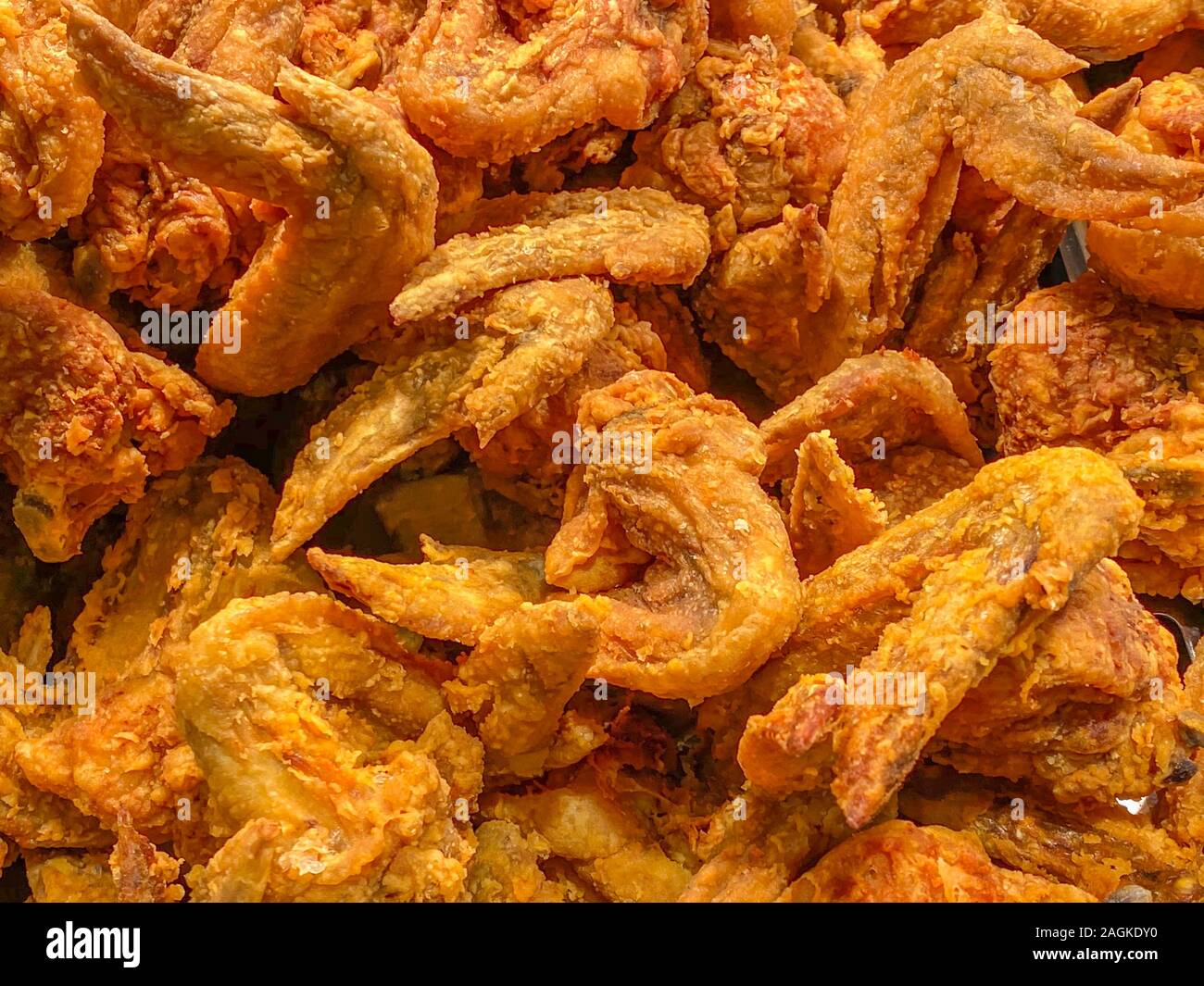 Closeup photo of crispy fried chicken wings with golden skin Stock ...