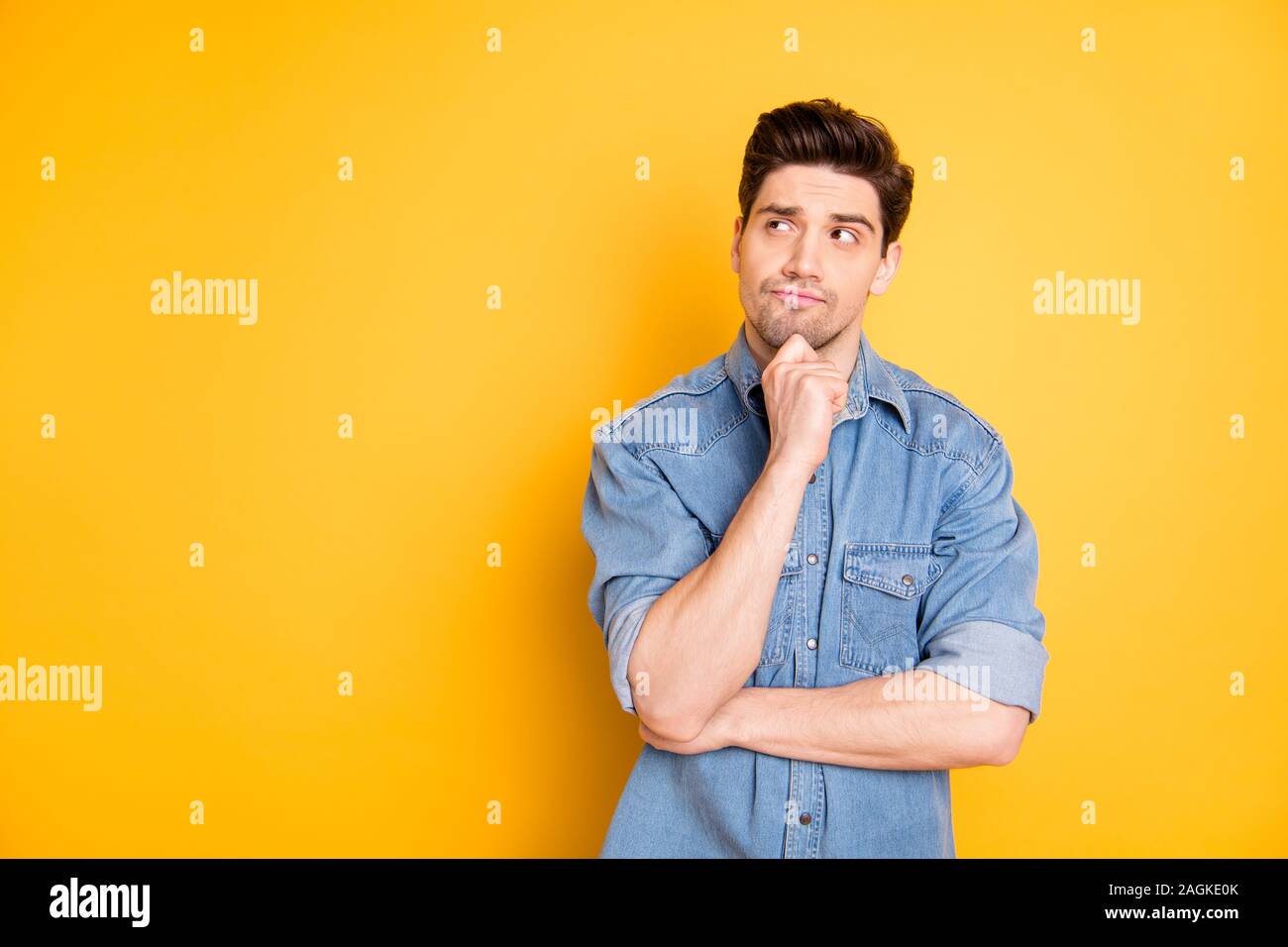 Photo of pensive interested man looking into empty space contemplating ...