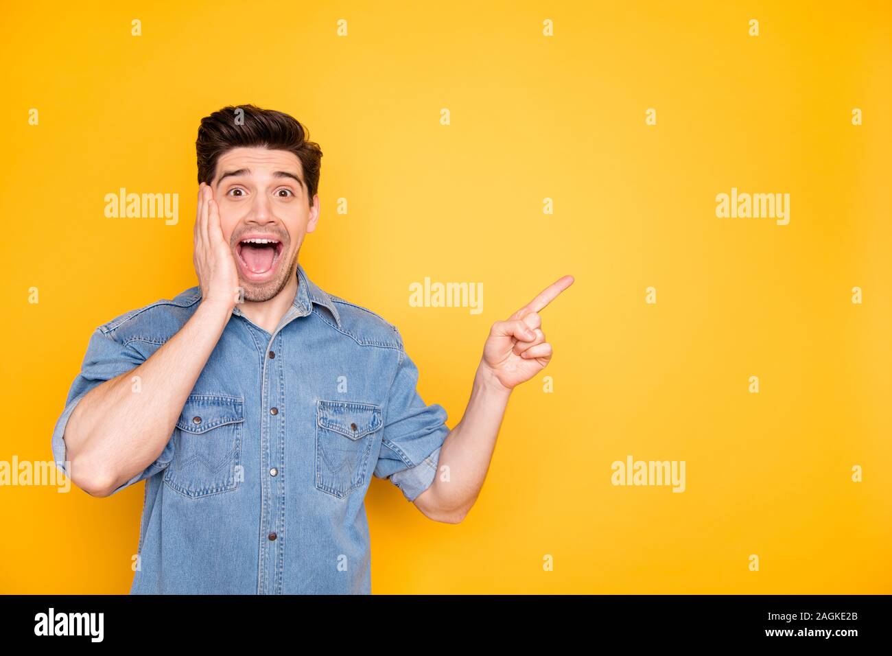 Photo of cheerful excited ecstatic crazy man in jeans denim expressing ...