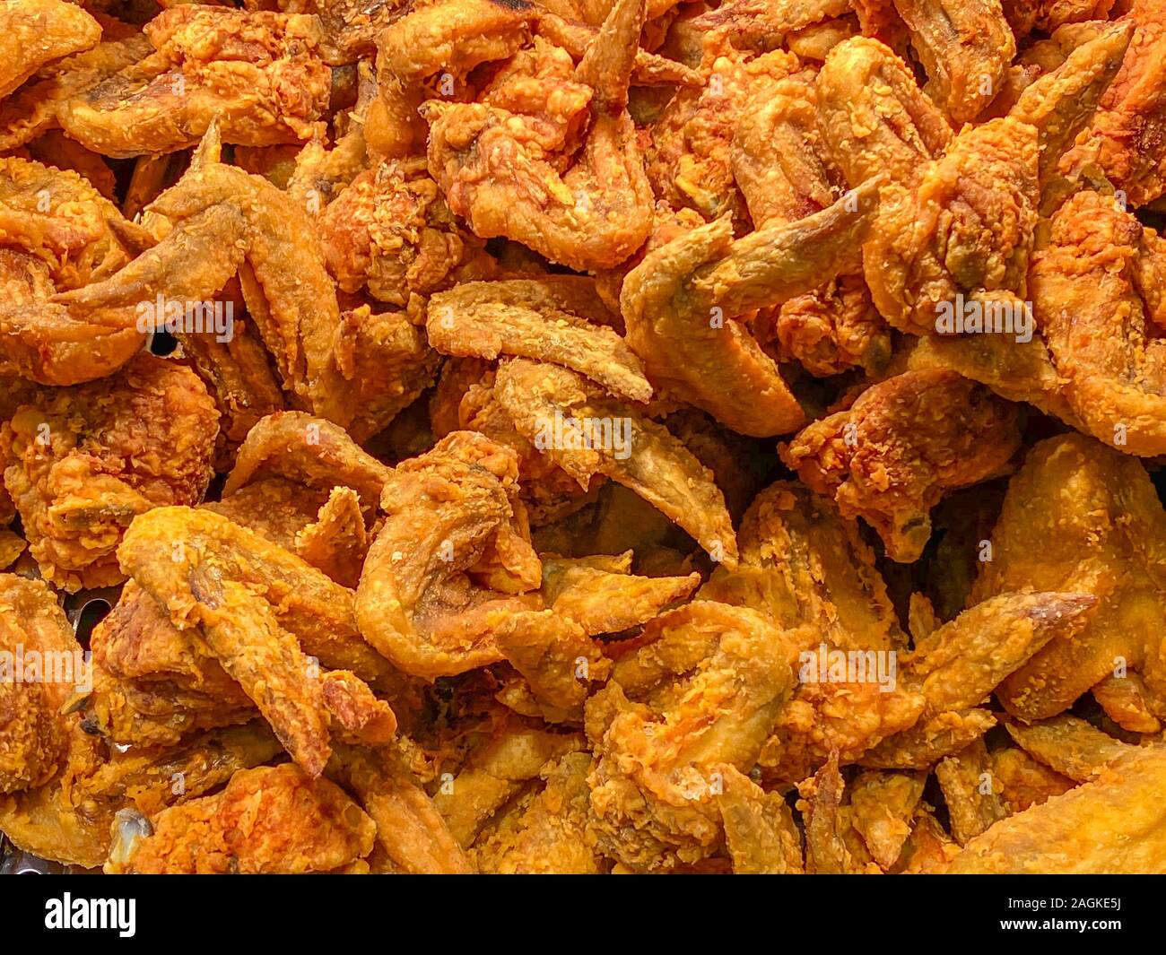 Big pile of deep-fried chicken wings for food background concept Stock ...