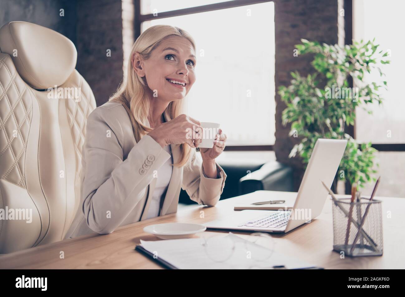 Photo of positive cheerful happy working programmer drinking tasty ...