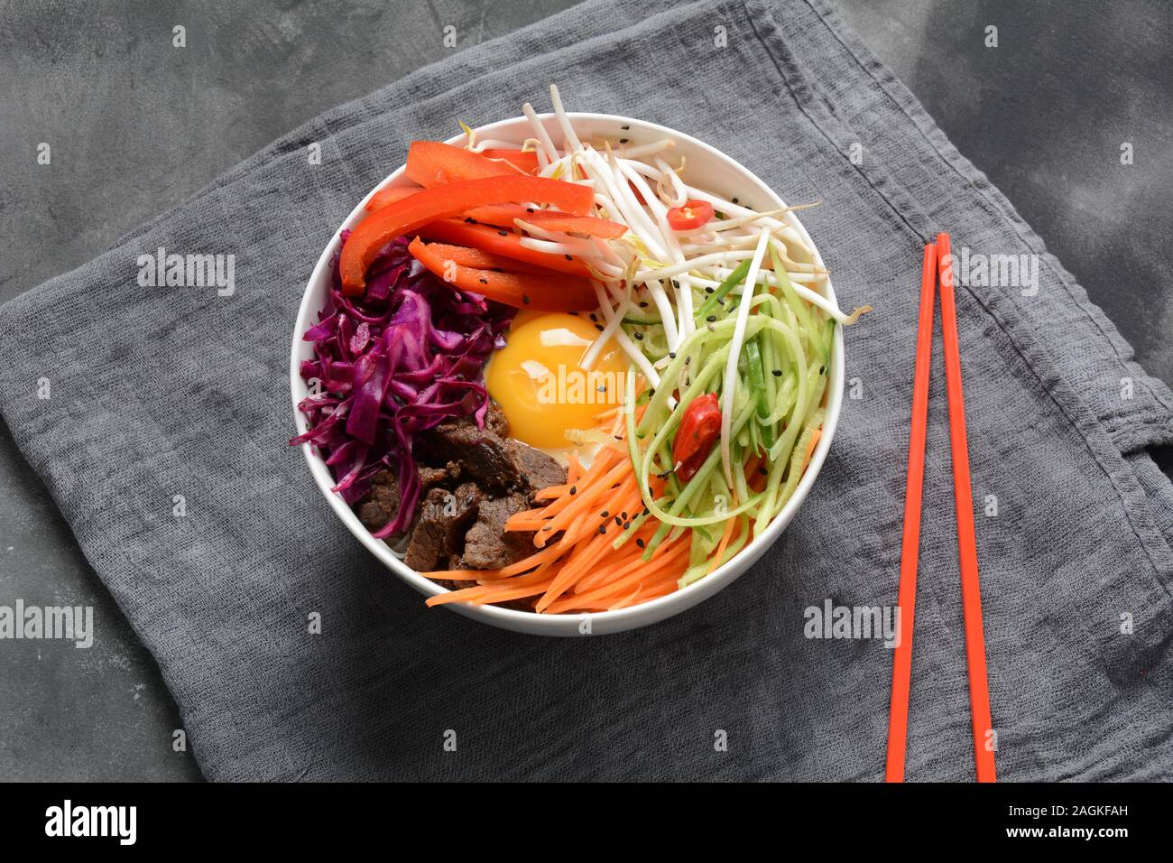 Traditional Korean dish- Bibimbap, rice with egg, beef and vegetables ...