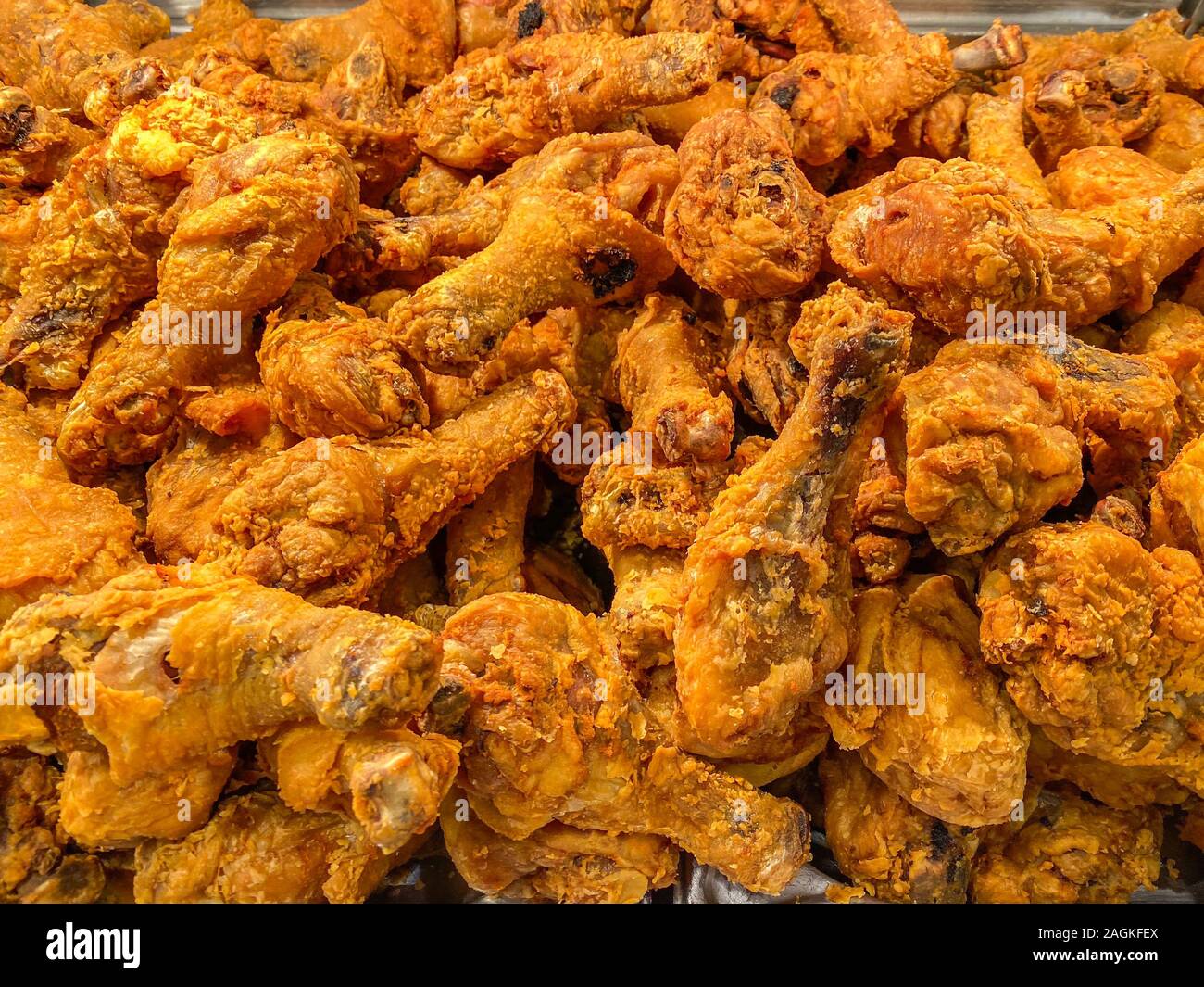 Pile of golden skin chicken drumsticks at fast food restaurant Stock ...
