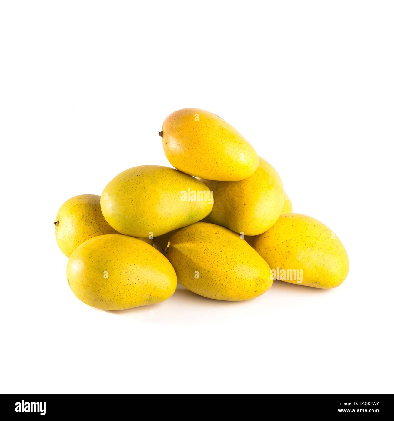 mangos or yellow mangos on a background new Stock Photo - Alamy