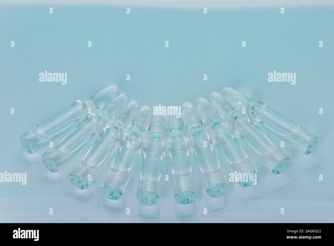Glass medical ampoule vial for injection. Medicine is dry white drug ...
