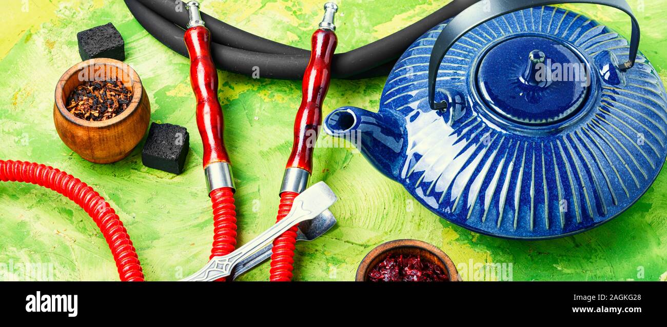 Details of tobacco hookah and teapot with tea.Egyptian smoking shisha ...