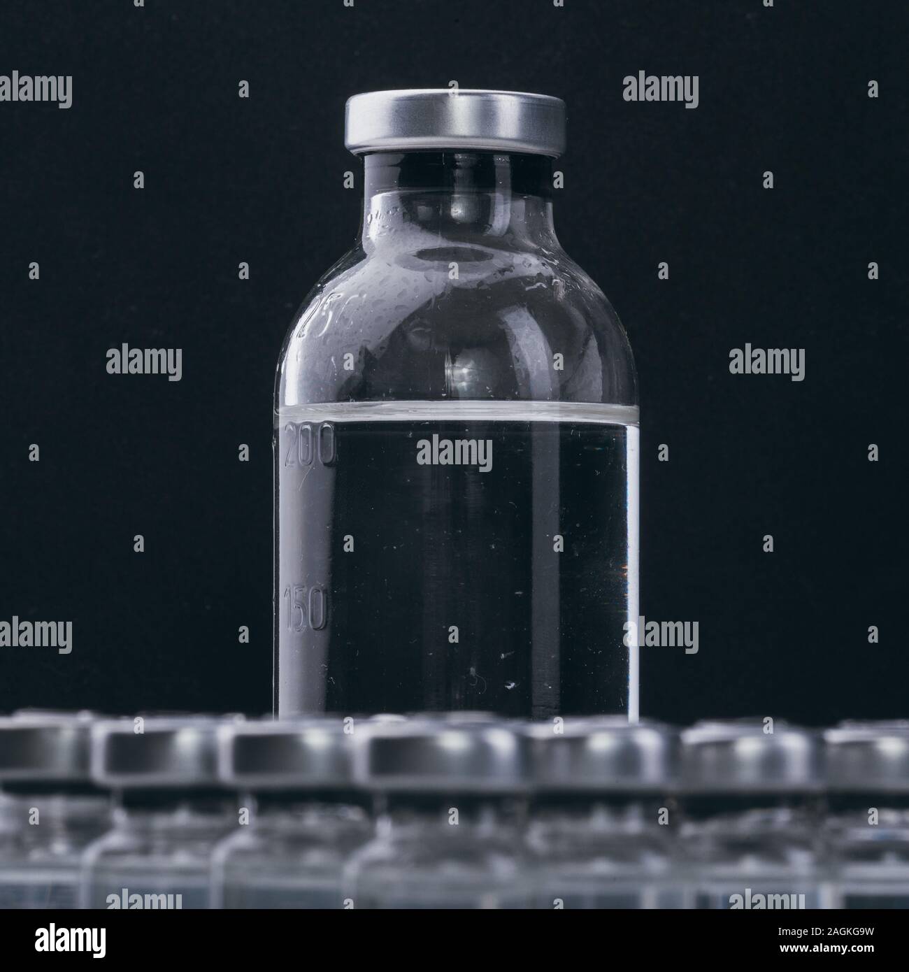 Glass medical ampoule vial for injection. Medicine is dry white drug ...