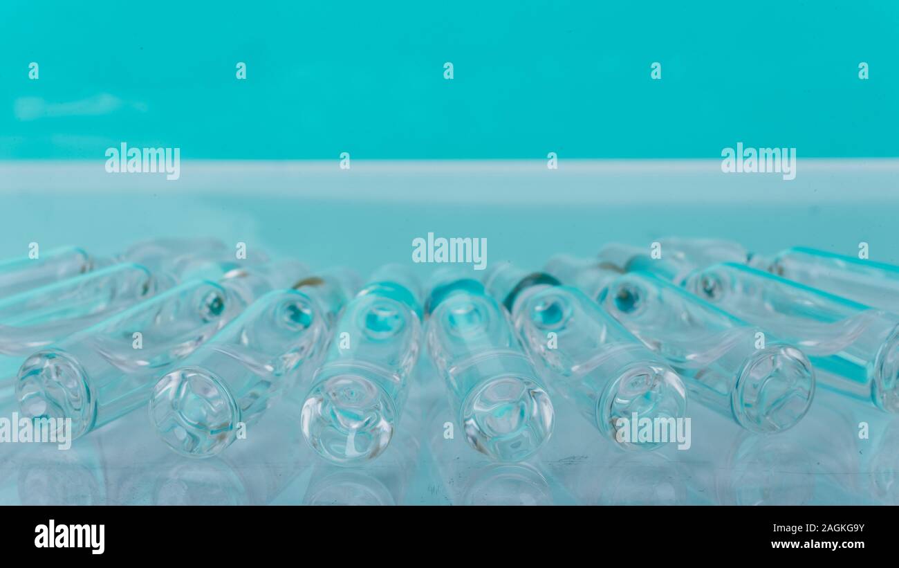 Glass medical ampoule vial for injection. Medicine is liquid sodium ...
