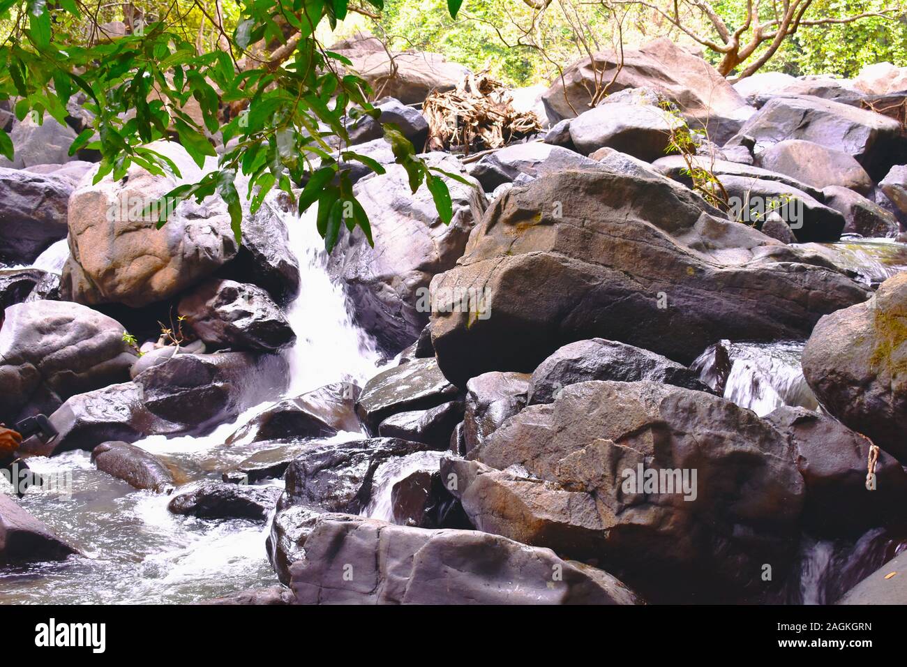 a small waterfall captured by high shutter speed Stock Photo - Alamy