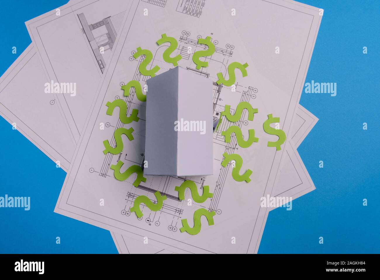 Paper skyscrapers , us dollar money, house projects plan and blueprints ...