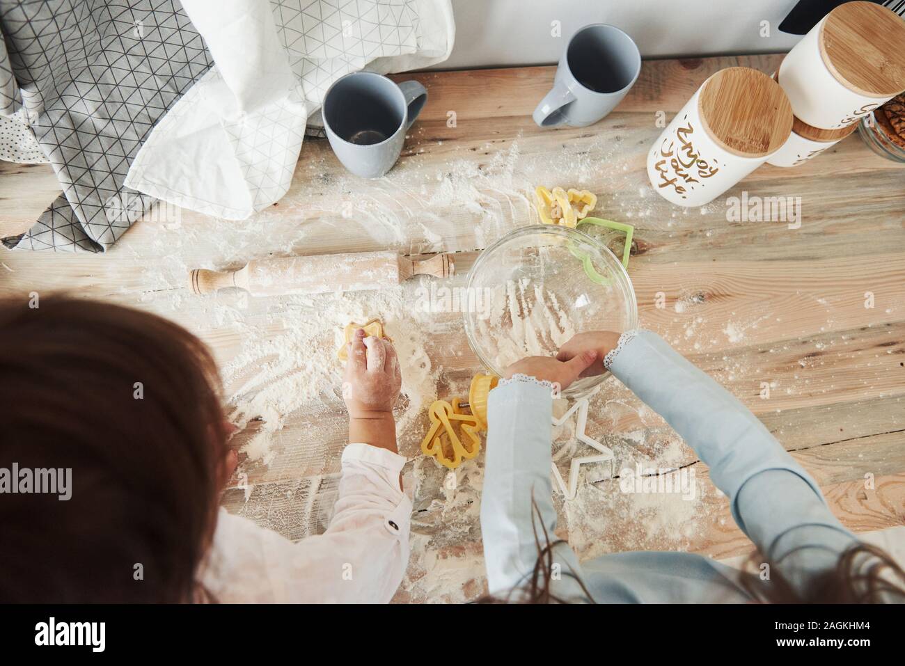 Top view of kids learning to prepare food from the flour with special ...
