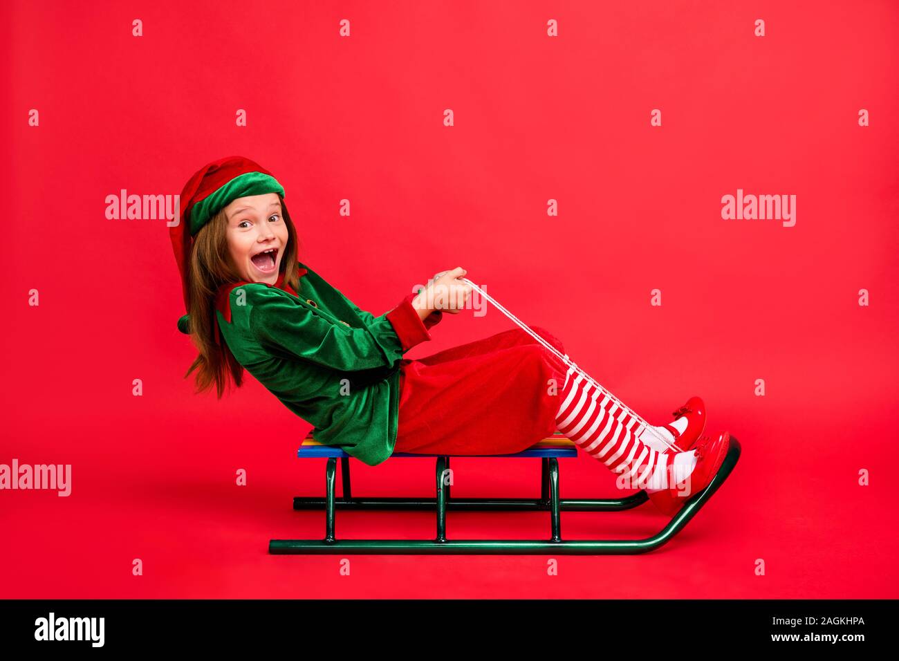 Full size profile side photo of crazy elf in green cap with red long ...