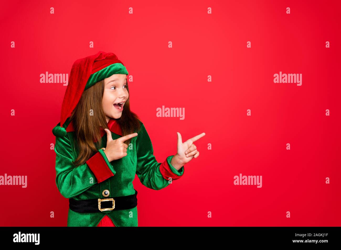 Profile side photo of surprised elf in hat cap showing ads with her ...