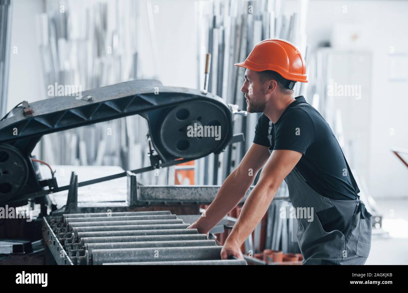 Production is on progress. Operator of machine. Industrial worker ...