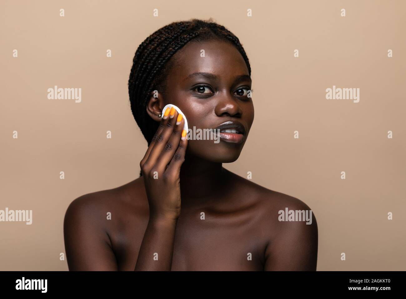 Close Up Portrait Of An Attractive African American Woman Removing