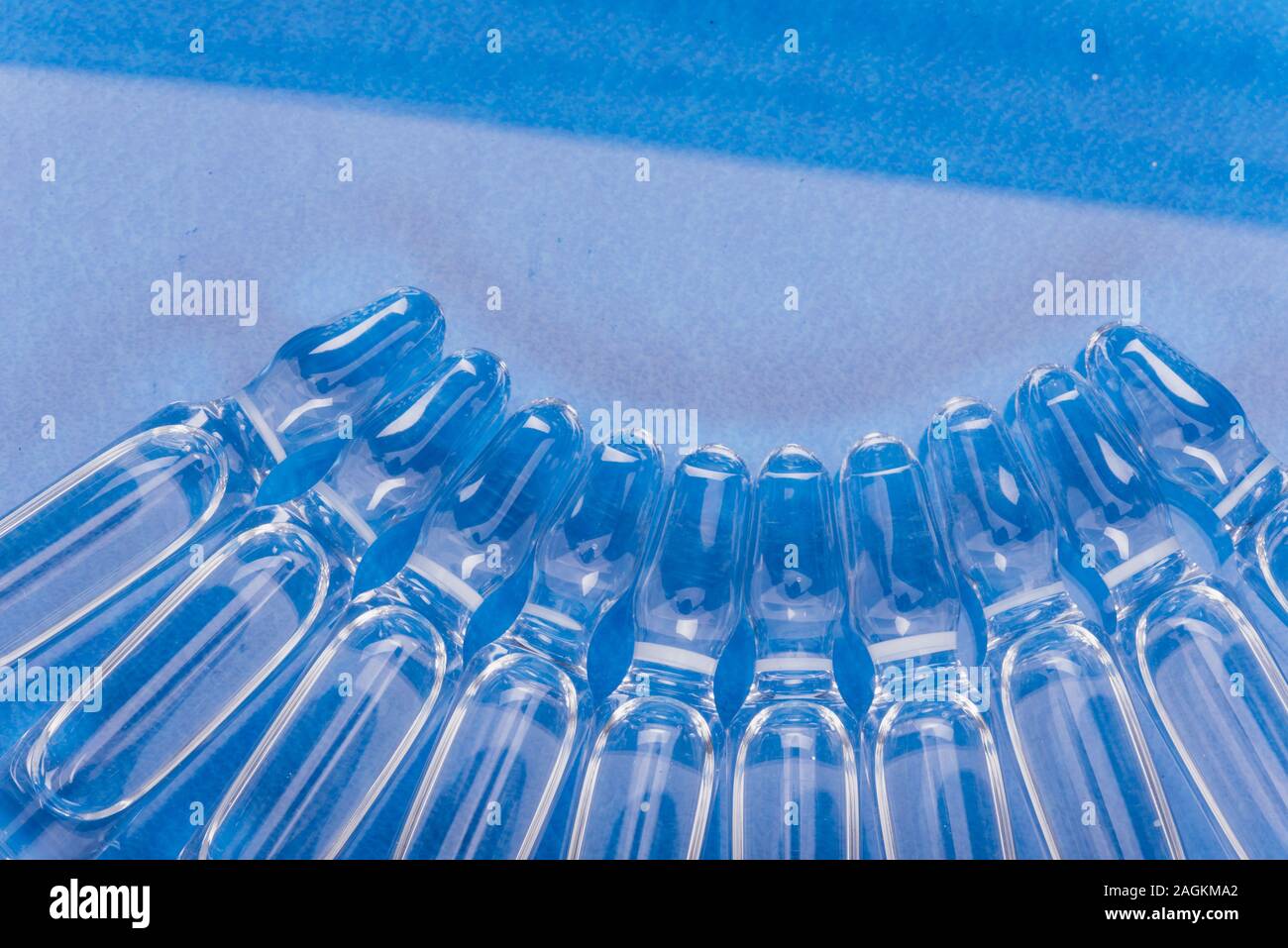Glass medical ampoule vial for injection. Medicine is liquid sodium ...