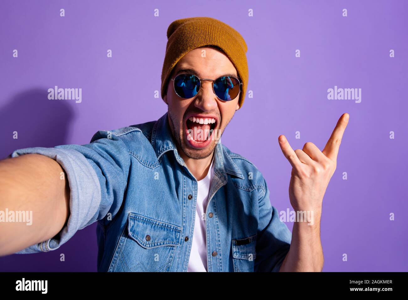 Self portrait of trendy stylish cheerful rude screaming guy taking ...