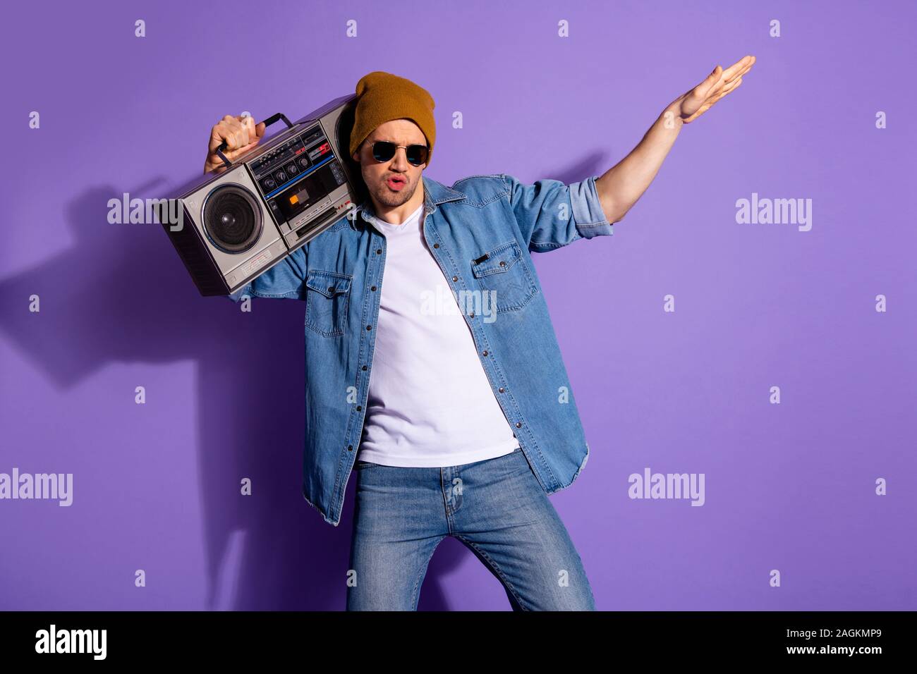 Photo of careless man dancing with loud bass music wearing jeans denim ...