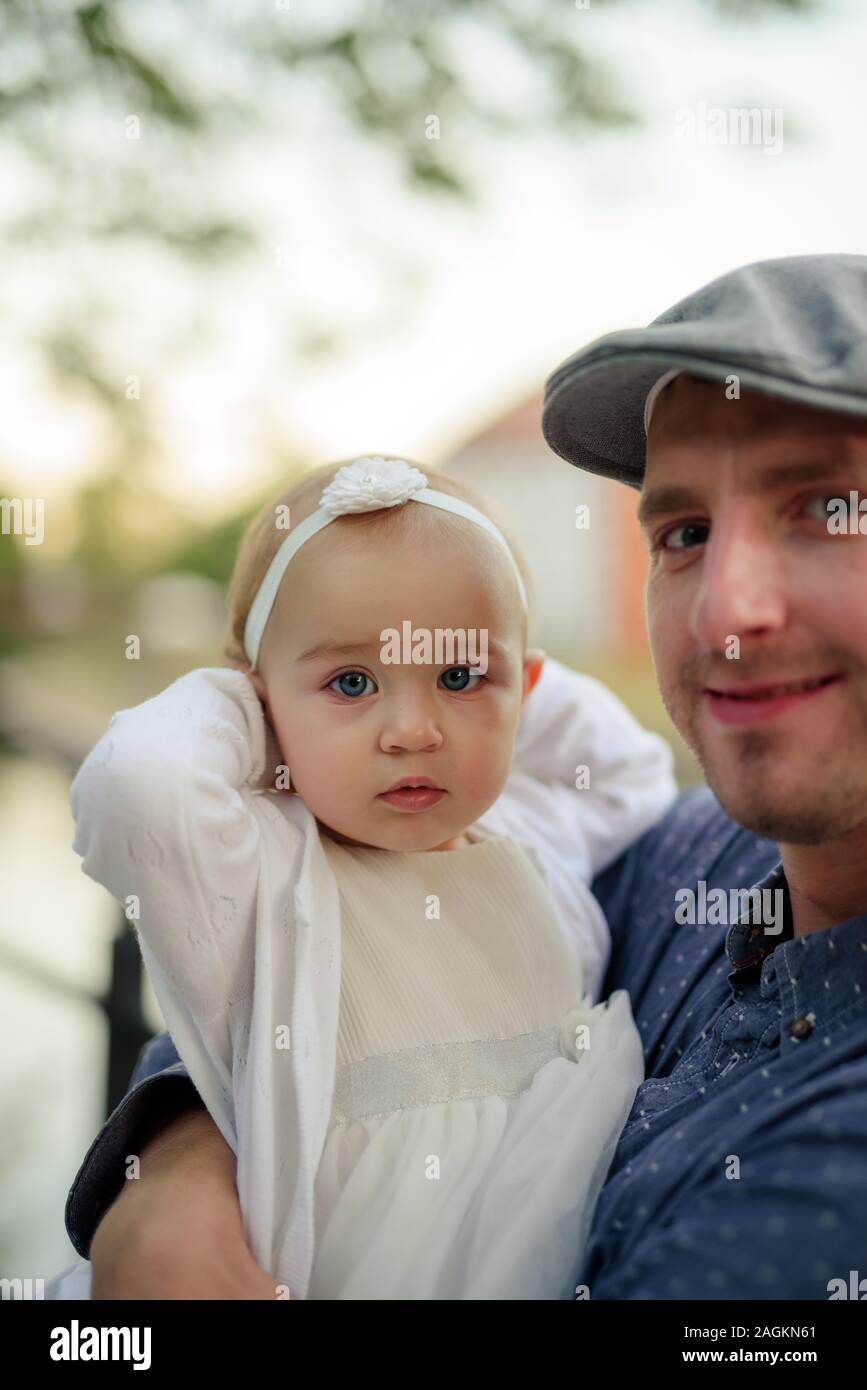 Happy loving family. Father and his daughter child girl playing and hugging outdoors. Cute ...