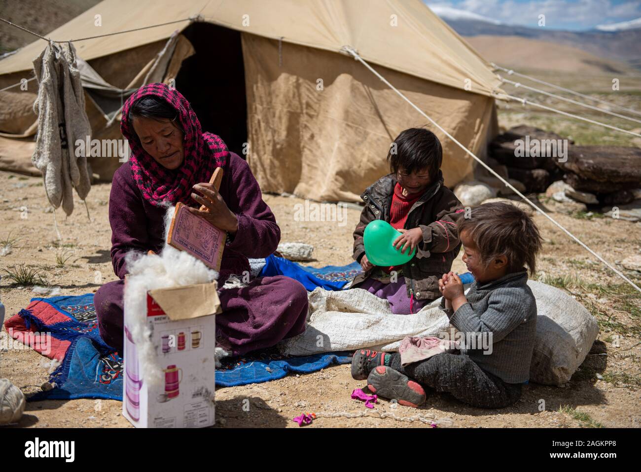 Woman carding wool fibers in Ladakh Stock Photo - Alamy