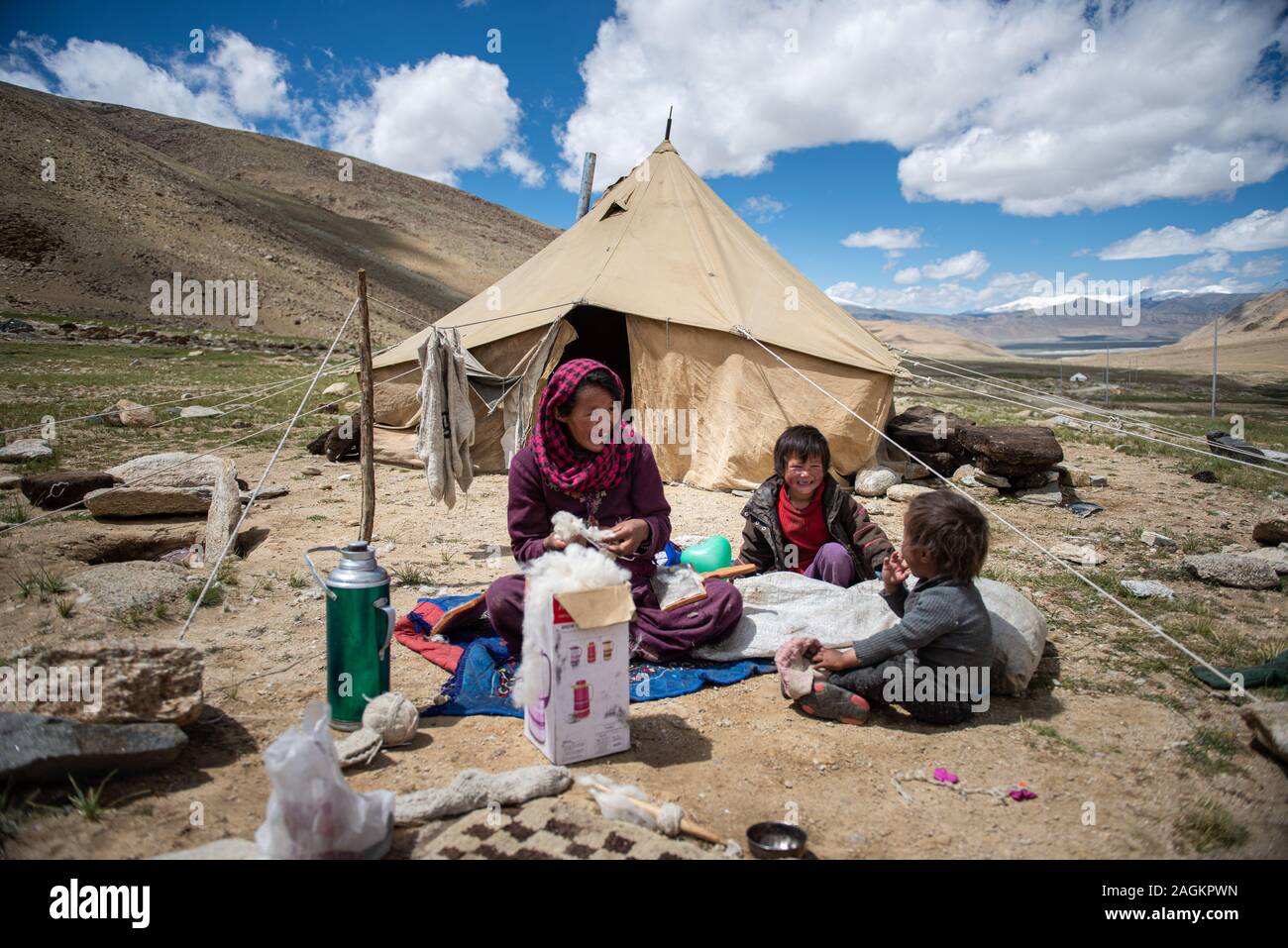 Woman carding wool fibers in Ladakh Stock Photo - Alamy