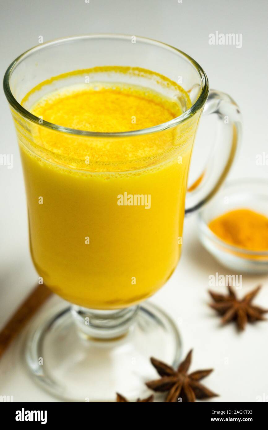 golden milk, with turmeric on white background Stock Photo - Alamy