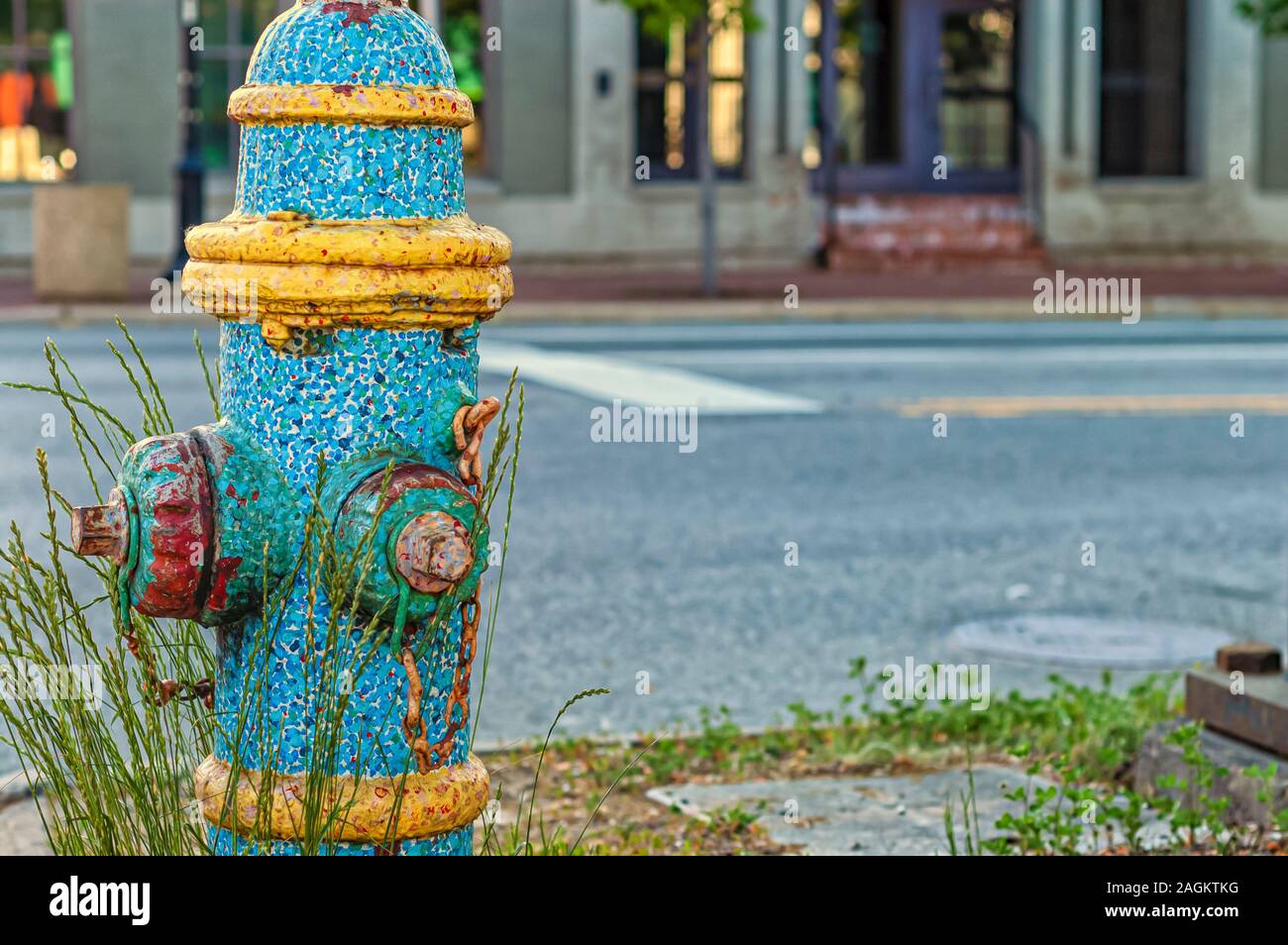 A colourful/colorful fire hydrant by a curve at downtown Ann Arbor ...