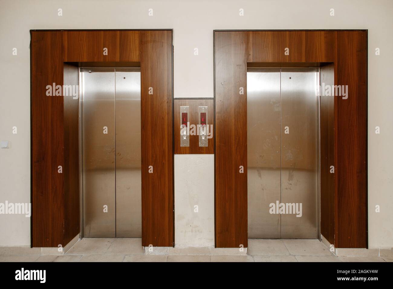 metal doors to the Elevator.Elevator with call buttons Stock Photo - Alamy