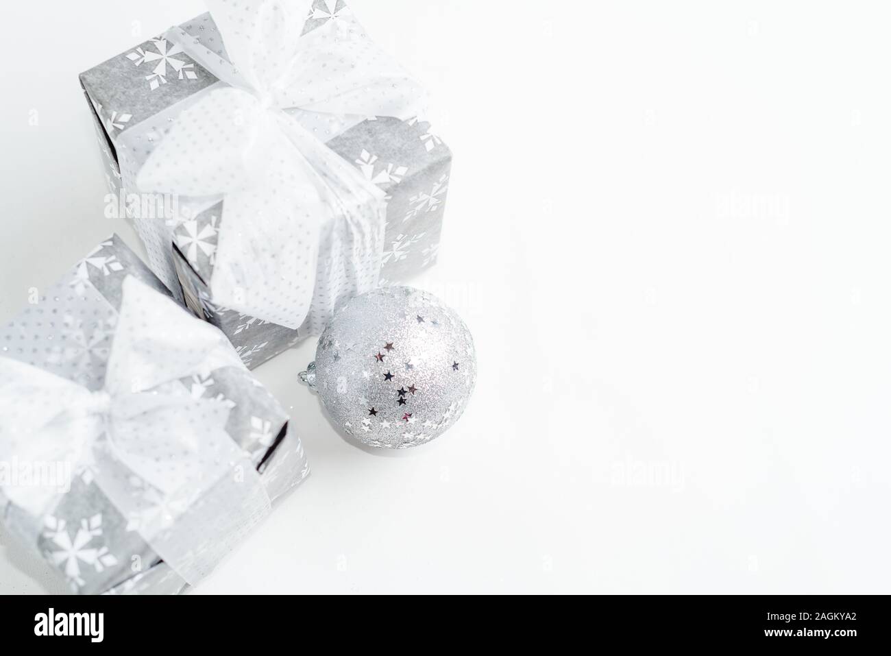 Christmas gift box with festive decoration in silver tone Stock Photo ...