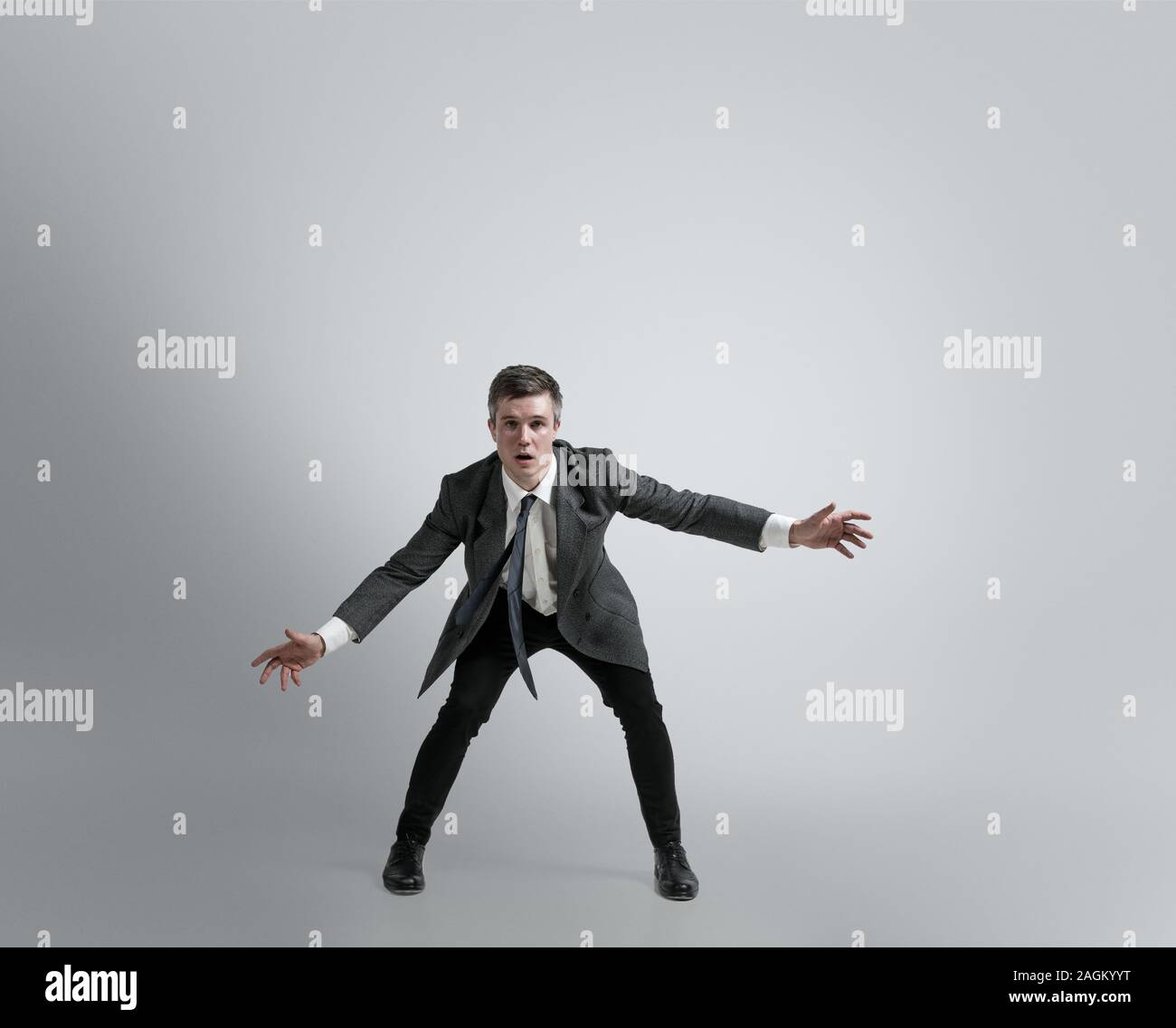 Dreams about big possibilities. Man in office clothes traines in ...