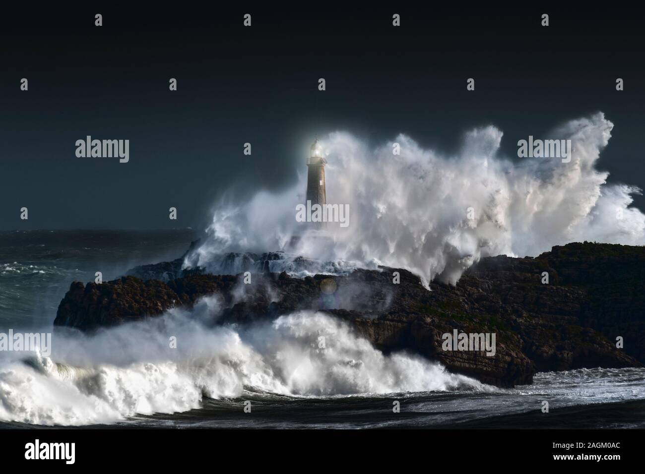 lighthouse in the storm with huge waves Stock Photo - Alamy