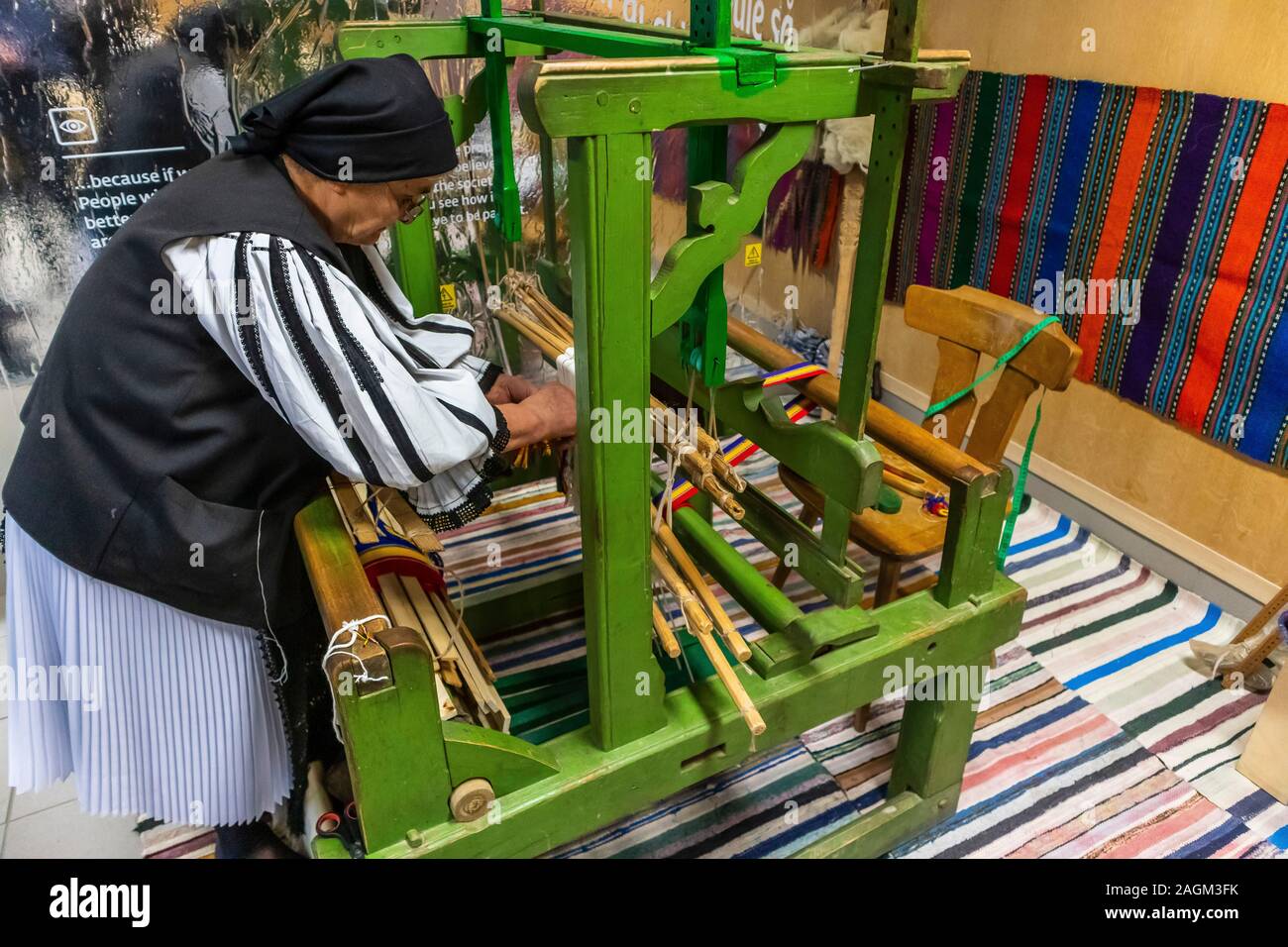 Woman working at hand weaving loom. Homemade Weaving Used for ...