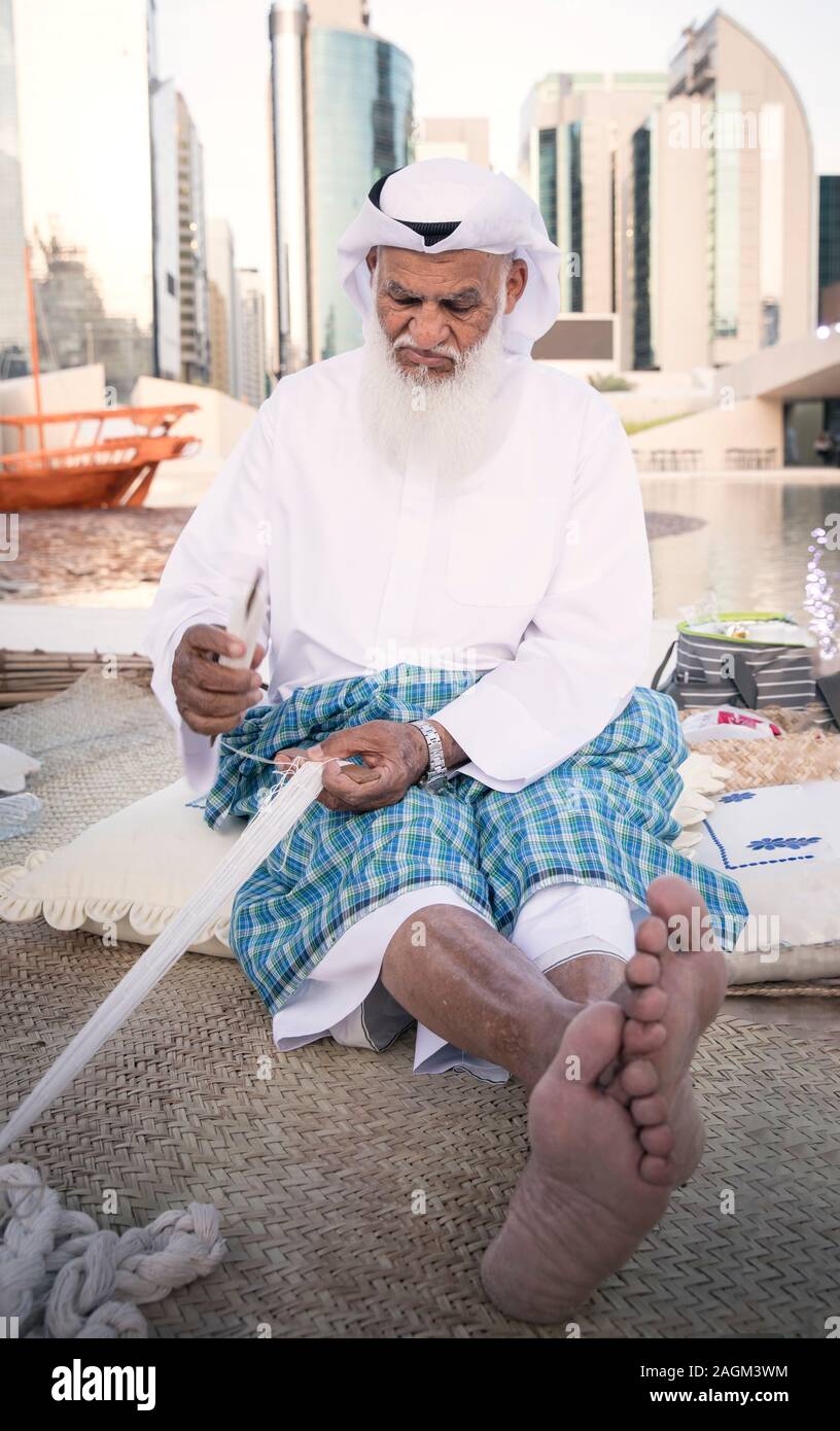 Abu Dabi, United Arab Emirates, 14th December 2019: fisherman making ...