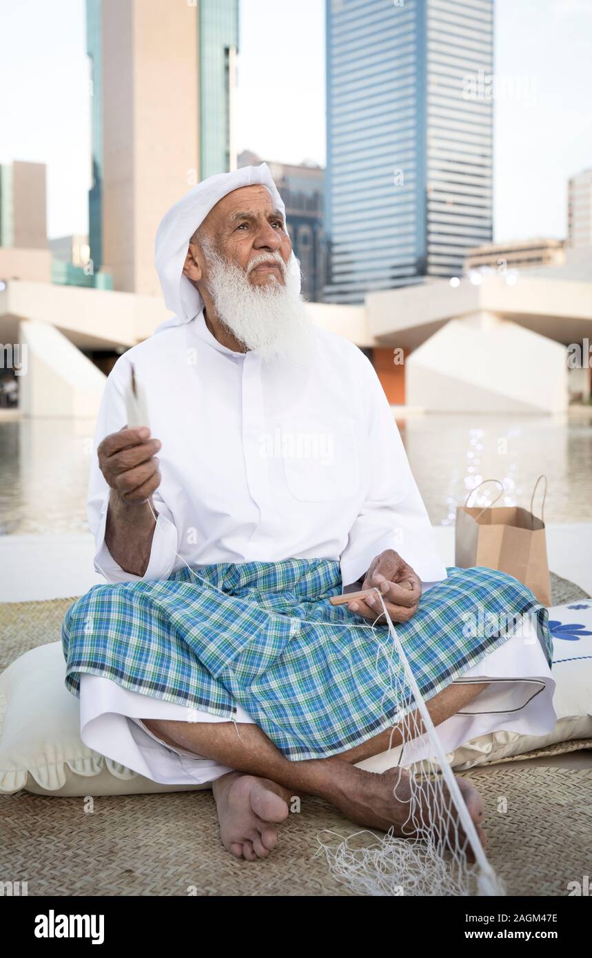 Abu Dabi, United Arab Emirates, 14th December 2019: fisherman making ...