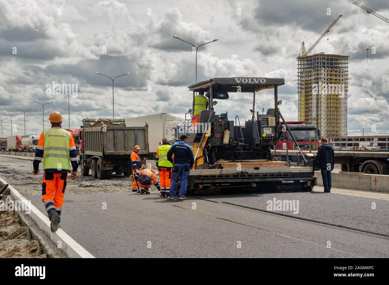 Asphalt road paver paving machine. Tyumen Stock Photo - Alamy